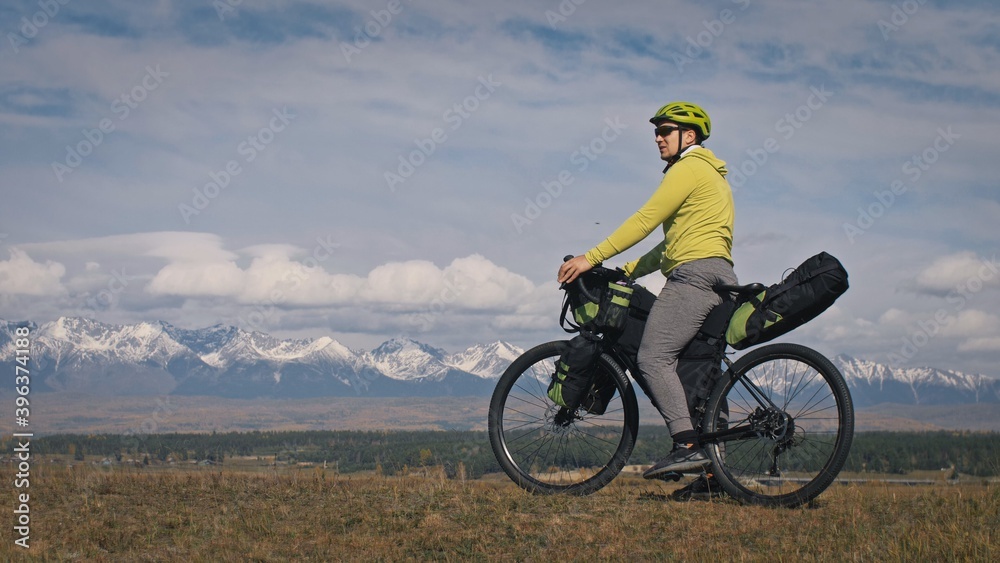 The man travel on mixed terrain cycle touring with bikepacking. The ...