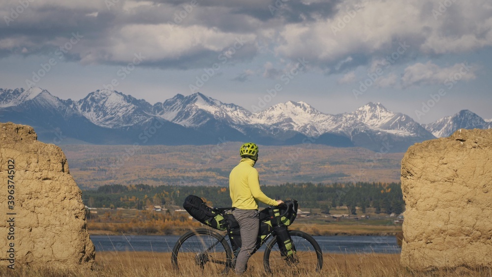 The man travel on mixed terrain cycle touring with bikepacking. The ...