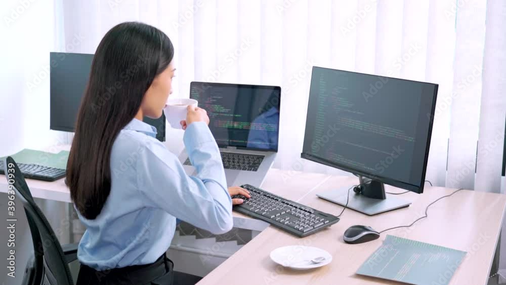Asian woman programmer typing source code with computer pc for Developing program or application ...