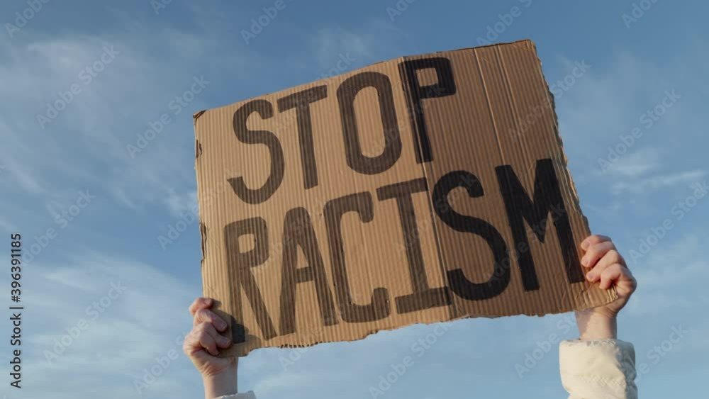 Vidéo Stock Stop Racism protester woman hands holding on cardboard Stop ...