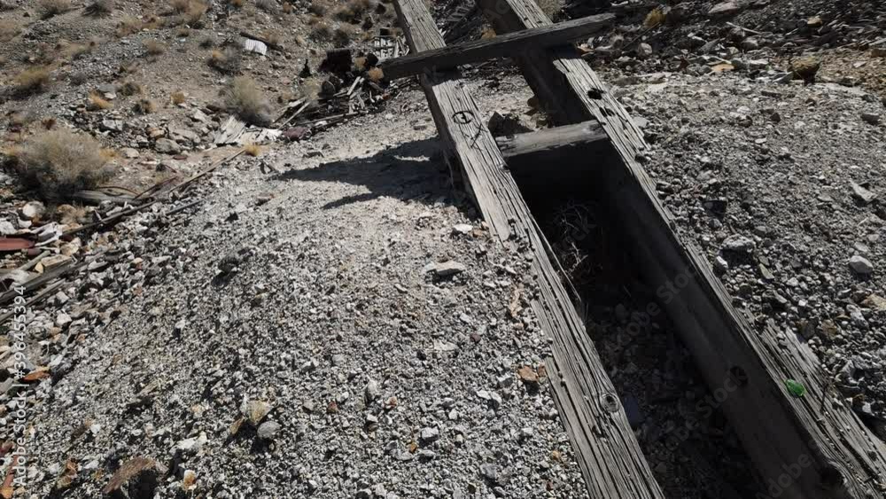 Tilt up over mine ore loading area and hill filled with abandoned trash ...