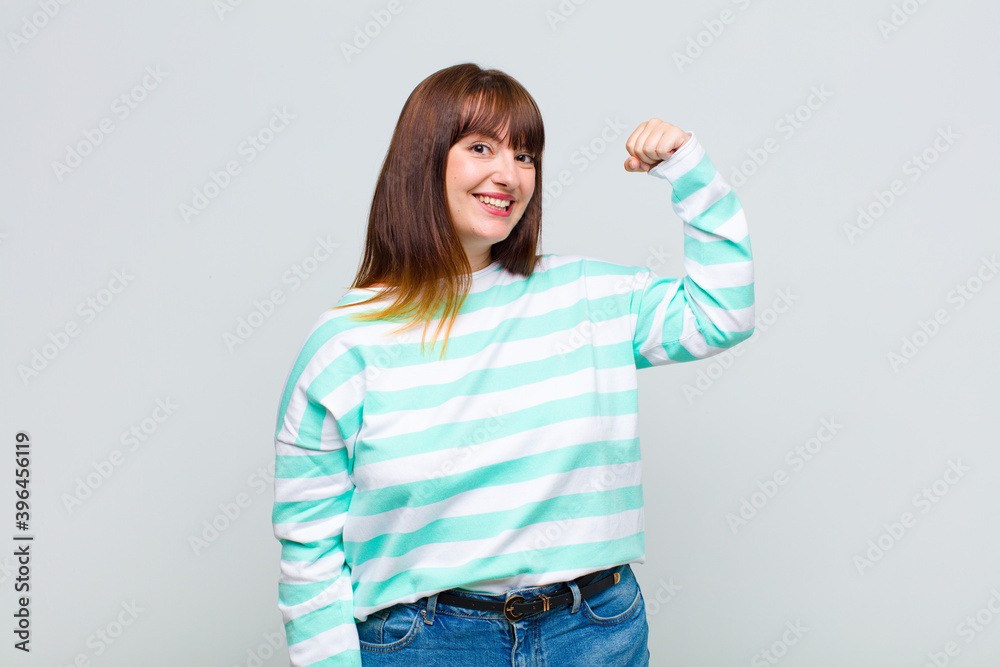 overweight woman feeling happy, satisfied and powerful, flexing fit and ...