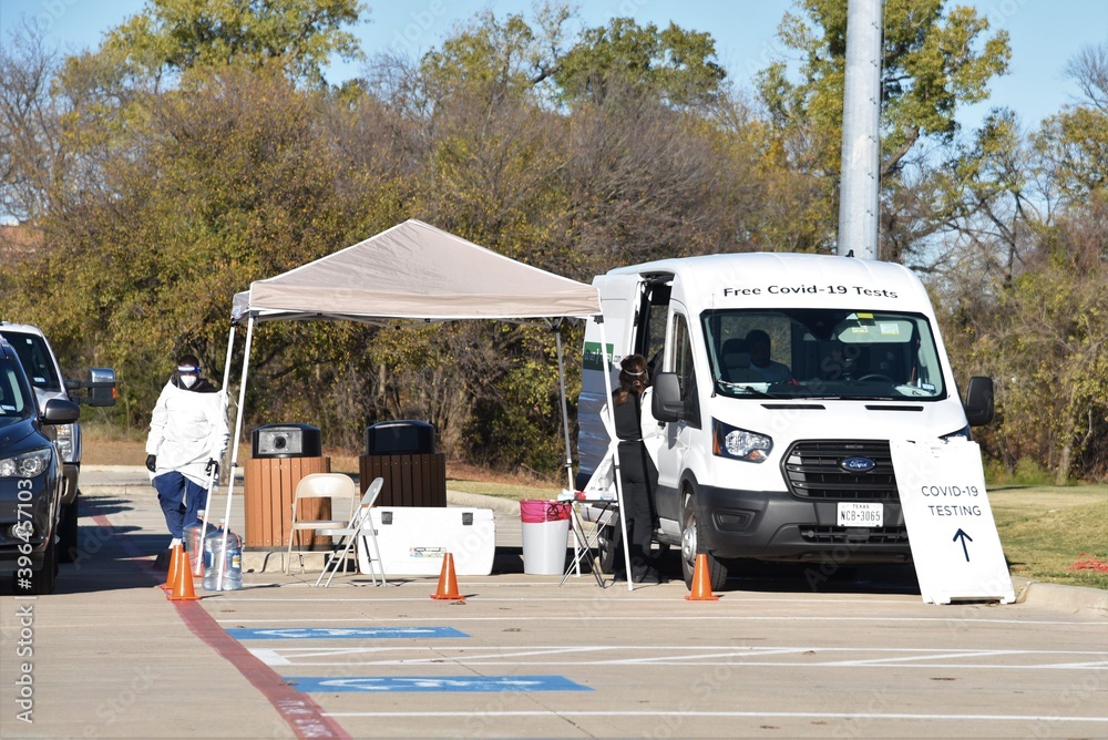Cars line up at the Covid-19 testing site for drive-thru testing ...