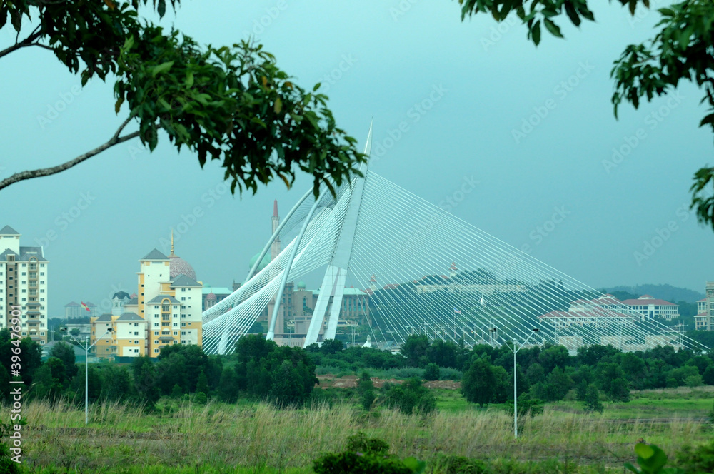 Seri Wawasan Bridge or Putra Bridge and Putrajaya Lake with blue sky ...