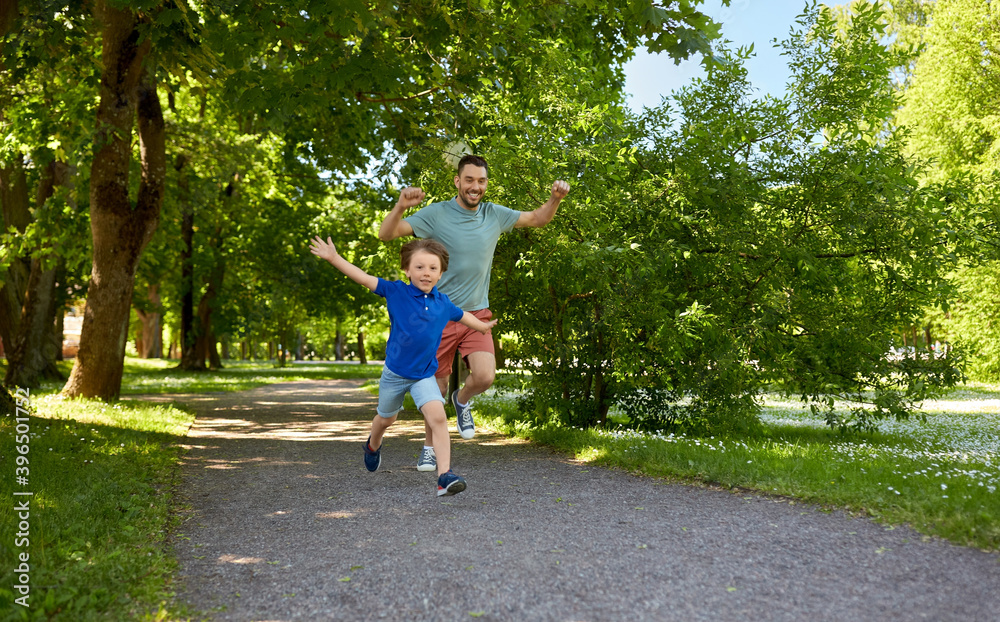 family, fatherhood and people concept - happy father with little son ...
