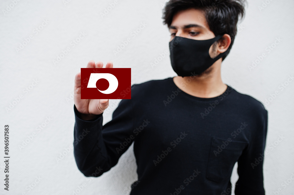 Japanese man wear all black with face mask hold Kumamoto flag in hand ...