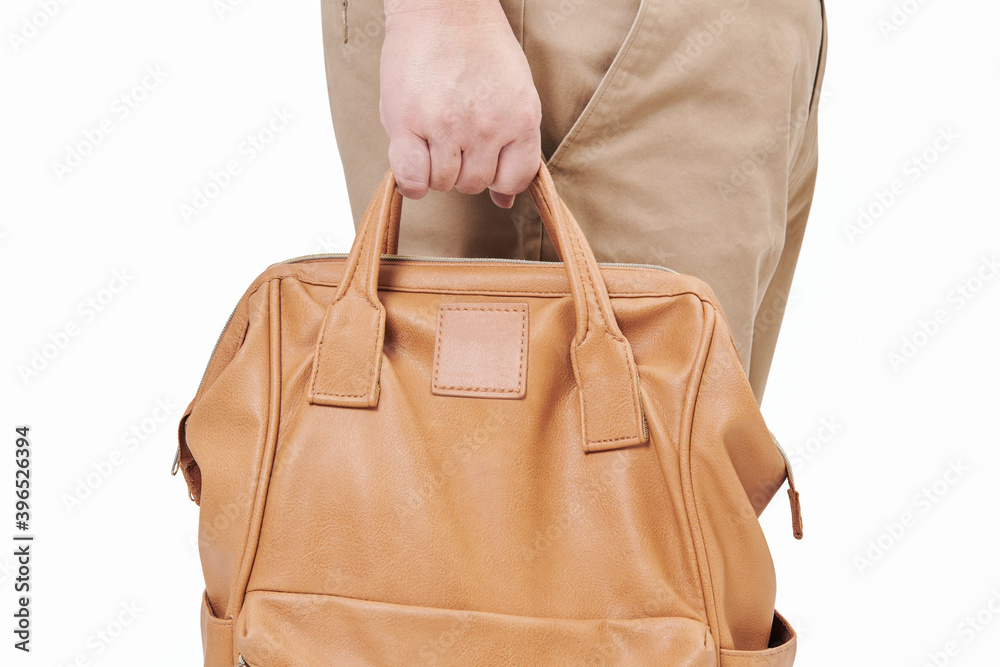 Person holding brown leather backpack mockup Stock Photo | Adobe Stock