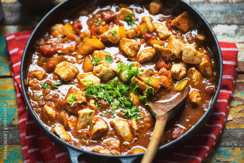 Chicken paneer with indian spices. Chicken pieces with yellow pepper in ...