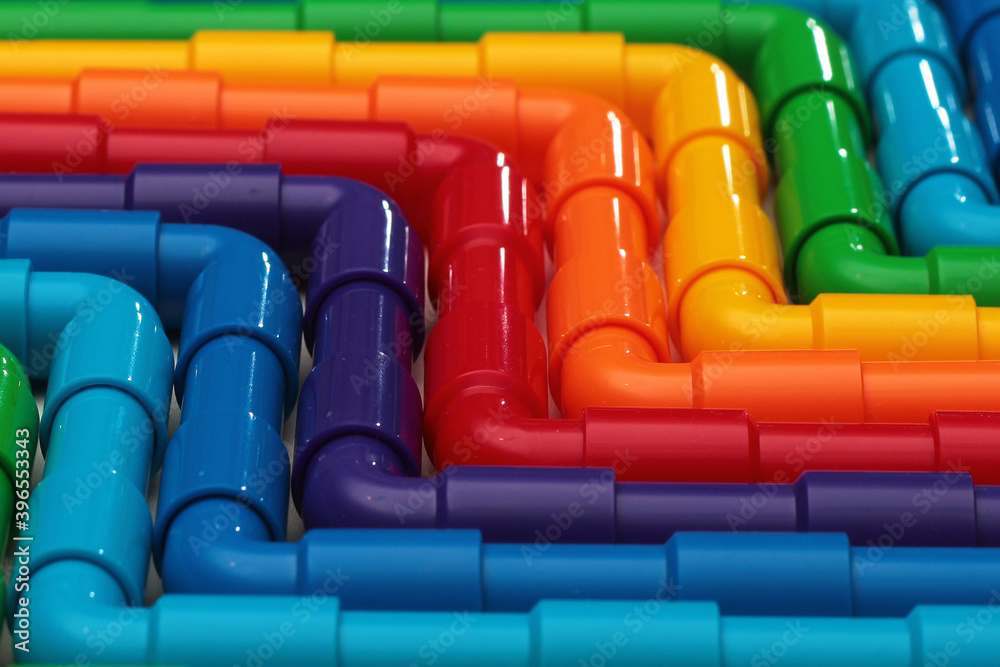 Rainbow colored plastic pipes as background Stock Photo | Adobe Stock