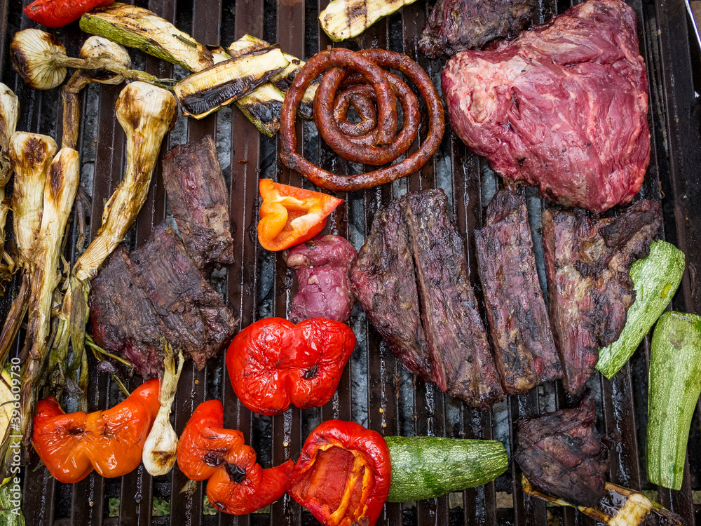 Top view, full-frame of Argentinian beef cuts, chorizo sausage ...
