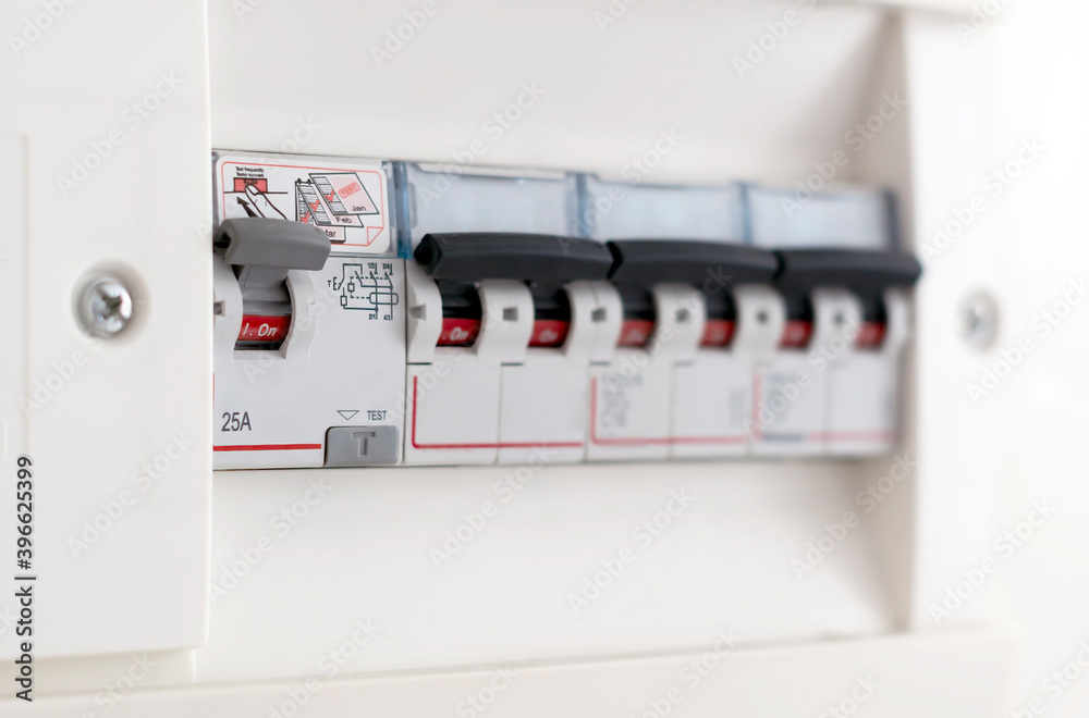 Detail of a switch in a domestic fuse box. Household electric utility ...