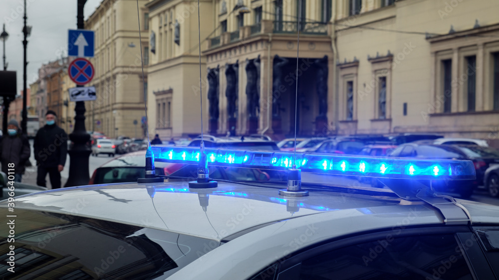 Red and blue lights of a police car, Abstract blurry image. Monitoring ...