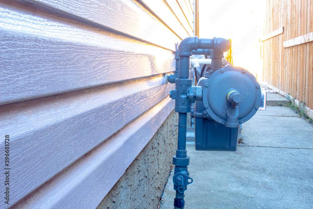 Side view of a residential urban natural gas meter, measuring gas ...