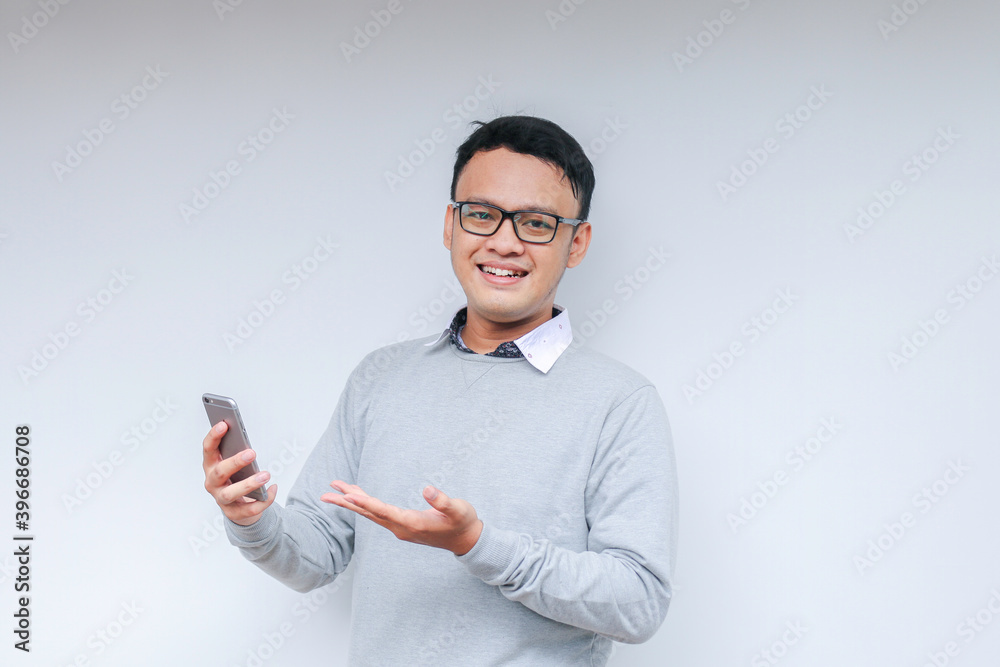Smart Young asian man is happy and smiling when using smartphone in ...