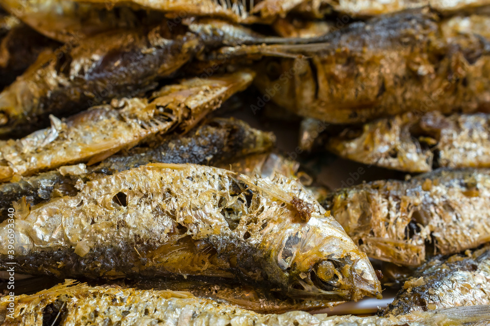 Closeup of deep fried sardines, locally known as Salinyasi. It is a ...