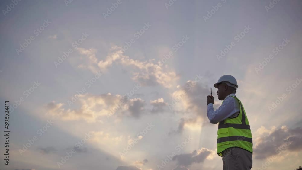 Wideo Stock: Asian electrical engineer working with radio walkie talkie ...