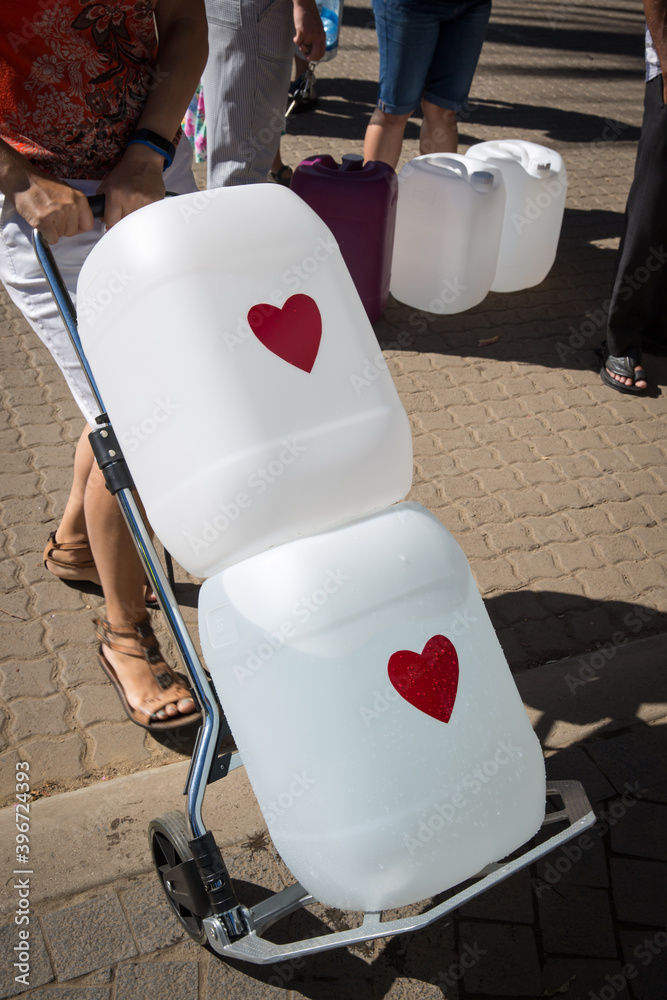 Collecting natural spring water with day zero water crisis with plastic ...