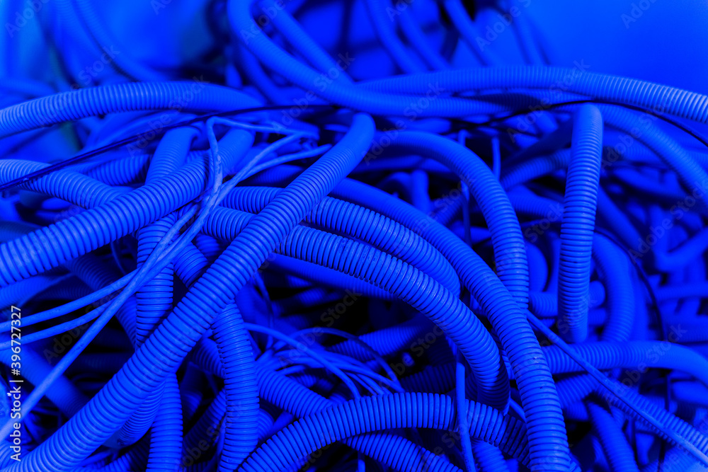 Pile of electrical high-voltage wires on floor. Industrial zone ...