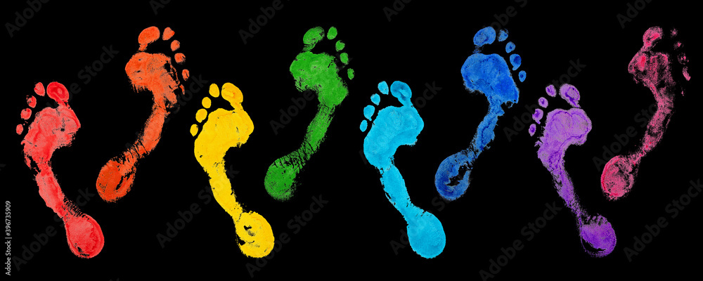 Rainbow color human footprints set black background isolated close up ...