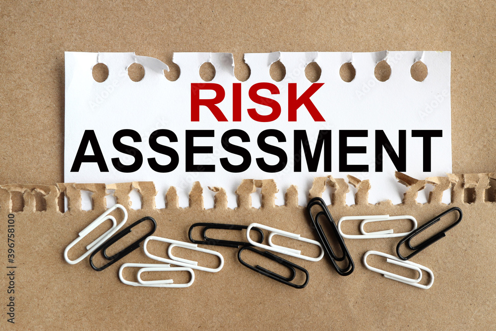risk assessment, text on white paper on torn paper background ภาพถ่าย ...