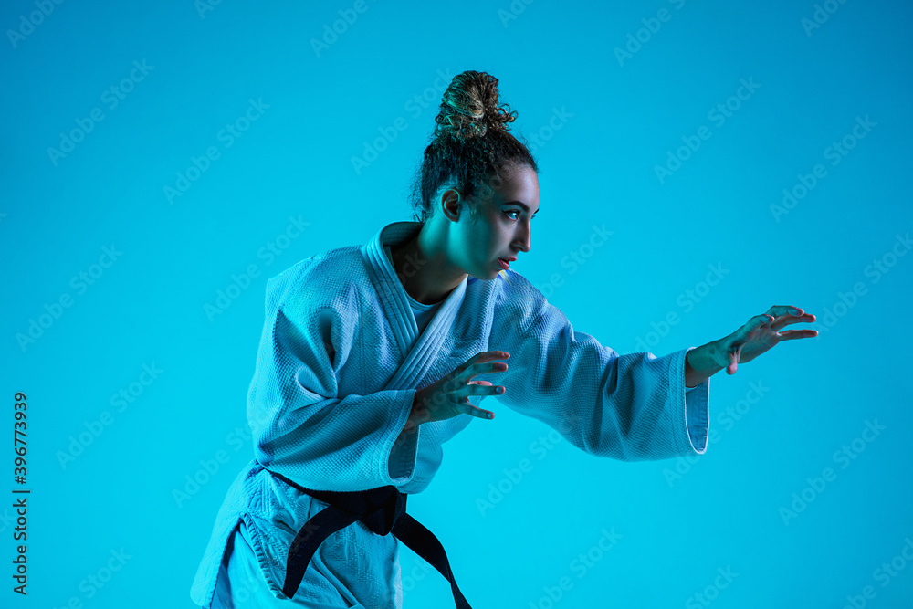 View from side. Professional female judoist in white judo kimono ...
