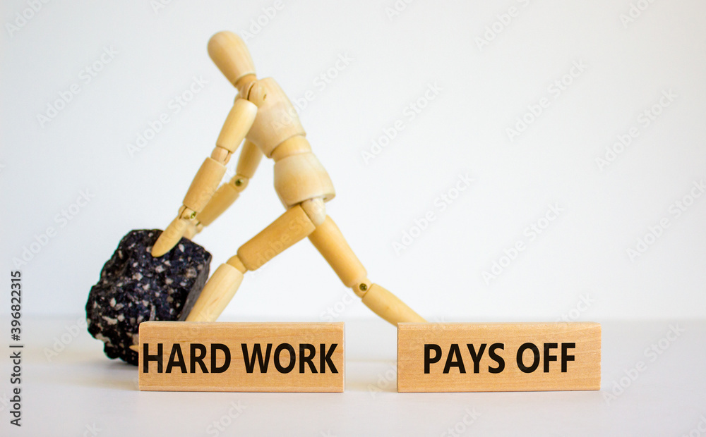 Hard work symbol. Wooden blocks with words 'hard work pays off'. Wooden ...