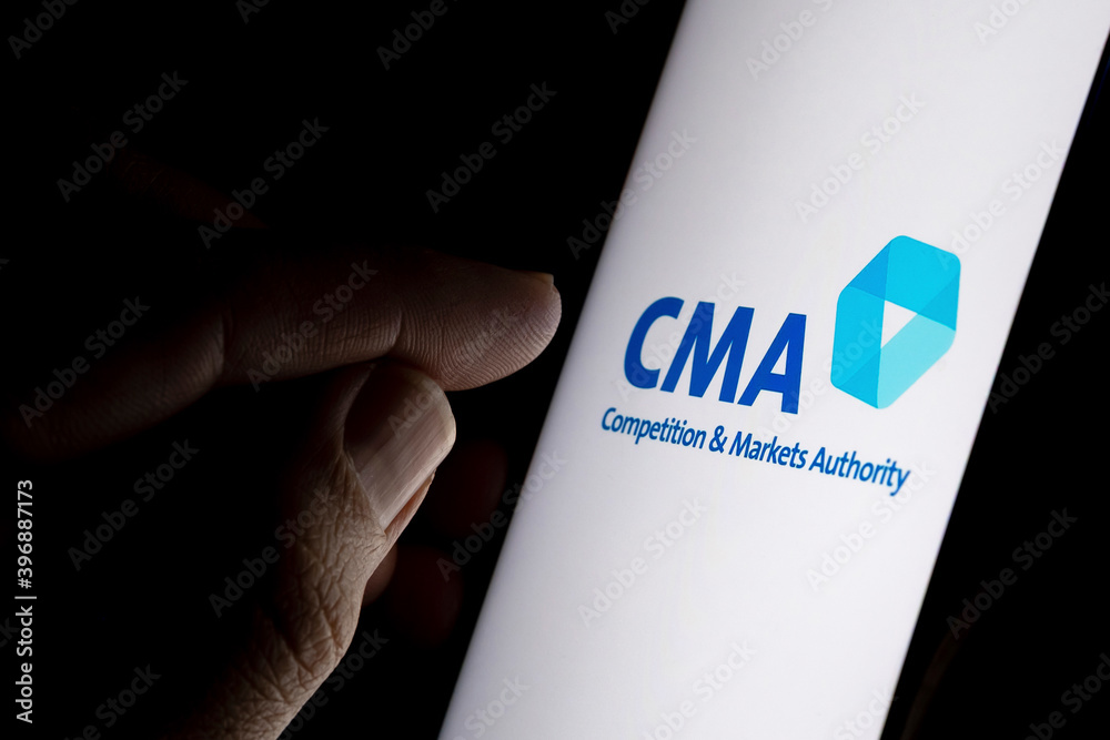 CMA Competition and Markets Authority logo on the screen and finger ...