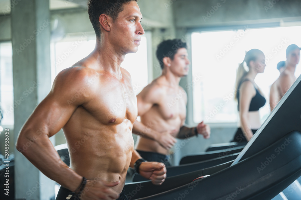 handsome and strong young man working out, Doing intense exercise in ...