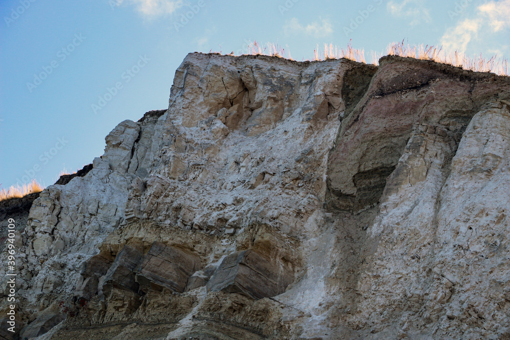 sandy-gypsum cut of the earth in quarry for the extraction of gypsum ...