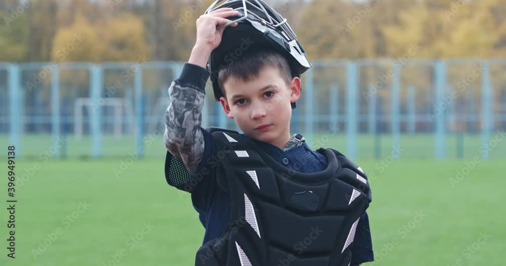 Portrait of a boy baseball player on a blurry background, the catcher ...