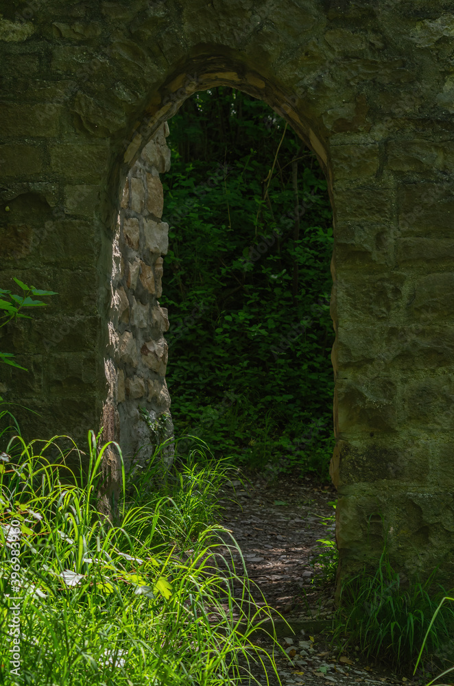 Medieval Wall Gate Arch - Archway in a medieval castle wall with sunlit ...