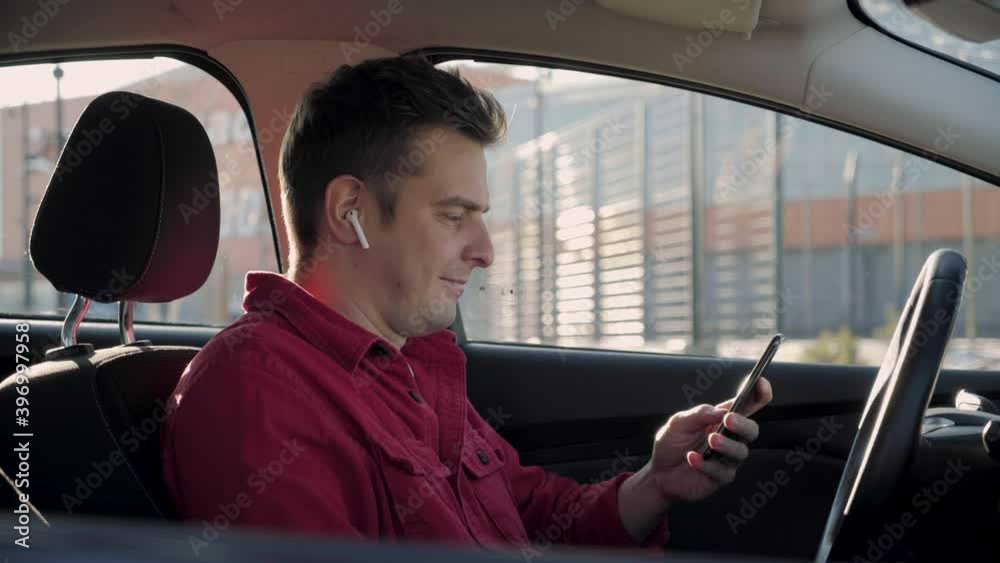 Relaxed taxi driver is listening to Music tired after work in Isolation ...