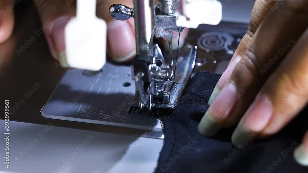 close up view of African American black hand with long nails using a ...
