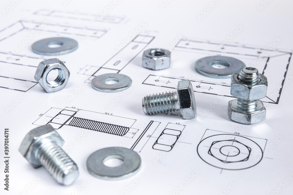 Technical drawing with bolts and nuts. Close-up picture taken in studio ...