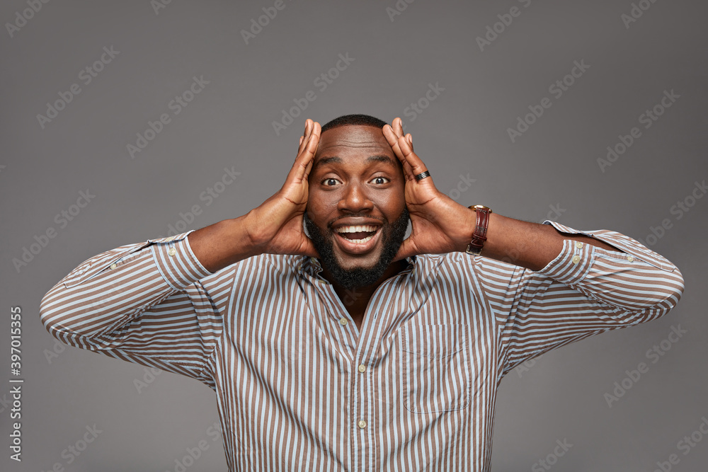 Satisfied and Amazed fellings. African American man with short beard is ...
