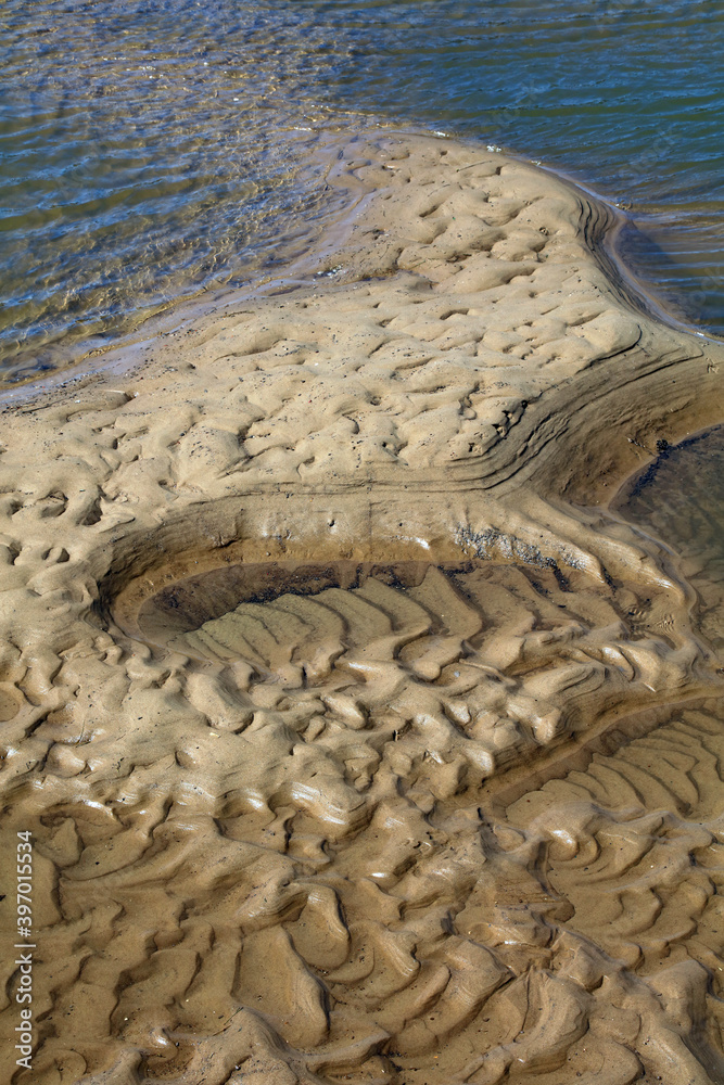 Patterns in sand created by waves Stock Photo | Adobe Stock