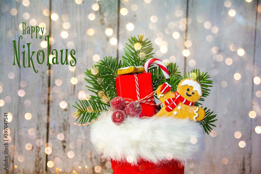 Happy Nikolaus - Santa Claus boot with gift box, candy cane and ...