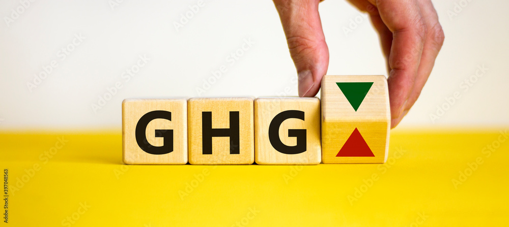 Greenhouse gas symbol. Concept words 'GHG, greenhouse gas' on cubes on ...
