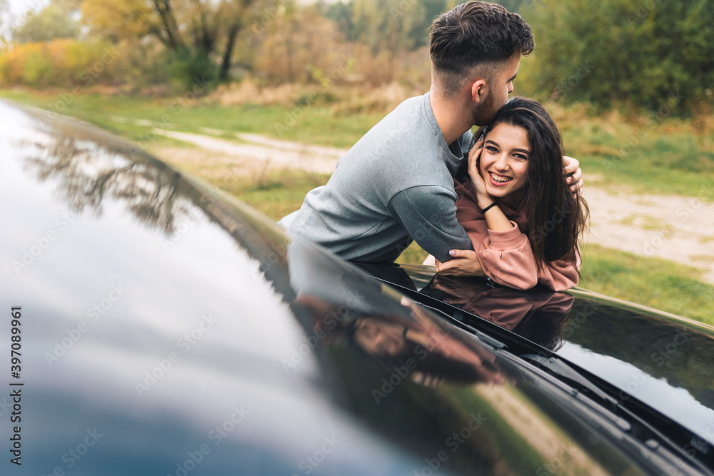 Romantic couple having fun fooling around near the car in nature Stock ...
