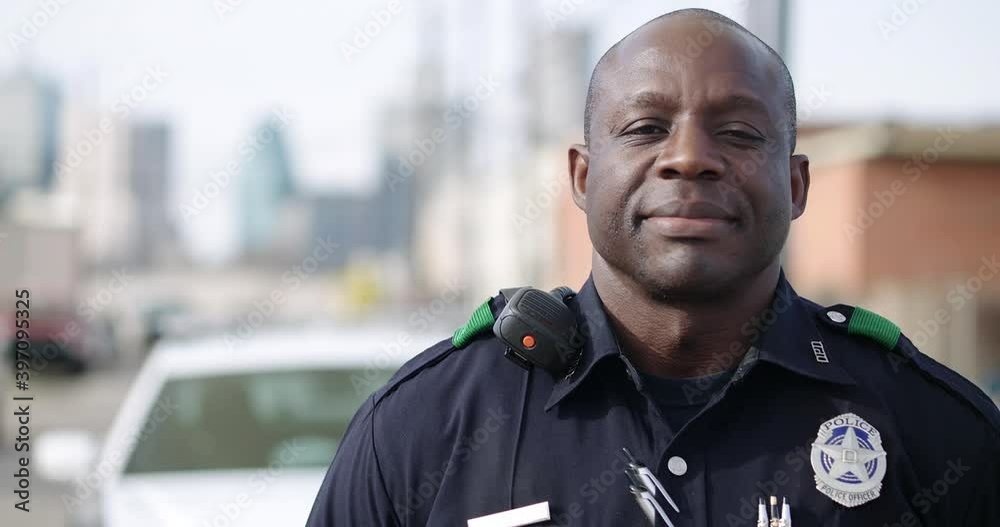Confident police officer looking at camera Stock Video | Adobe Stock