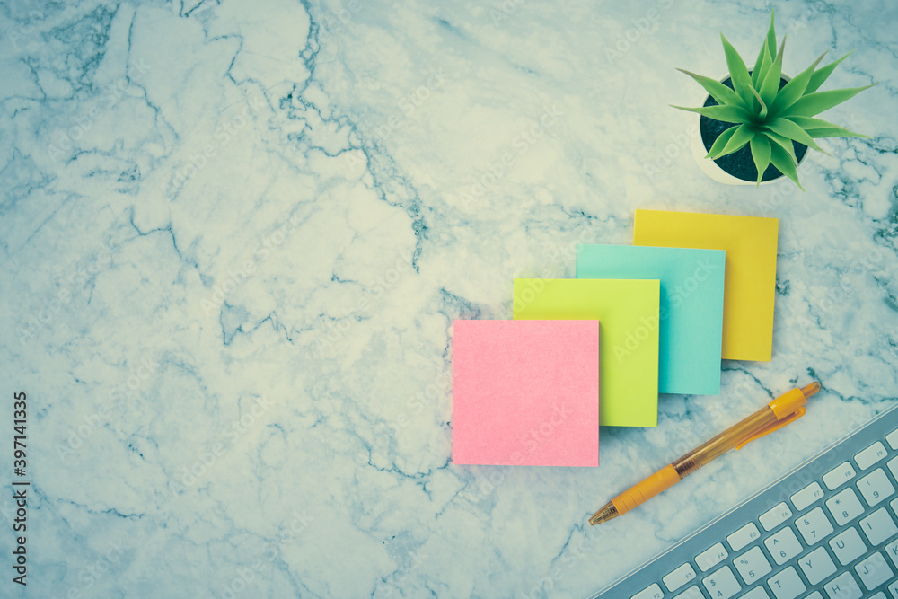 Four Color Stick Note or Notepad and Computer Keyboard and Office Plant ...