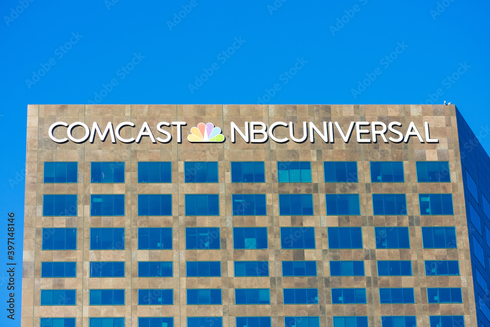 Comcast NBCUniversal sign, logo on facade of rhombic skyscraper ...