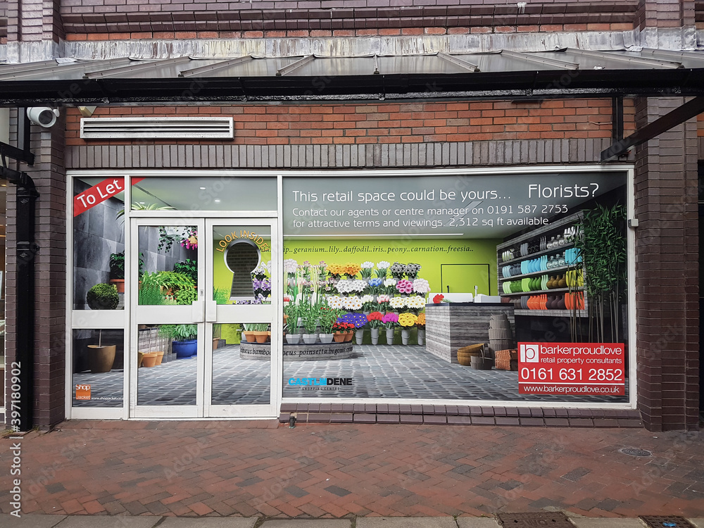 Empty retail shop unit with to let fake window display in high street ...