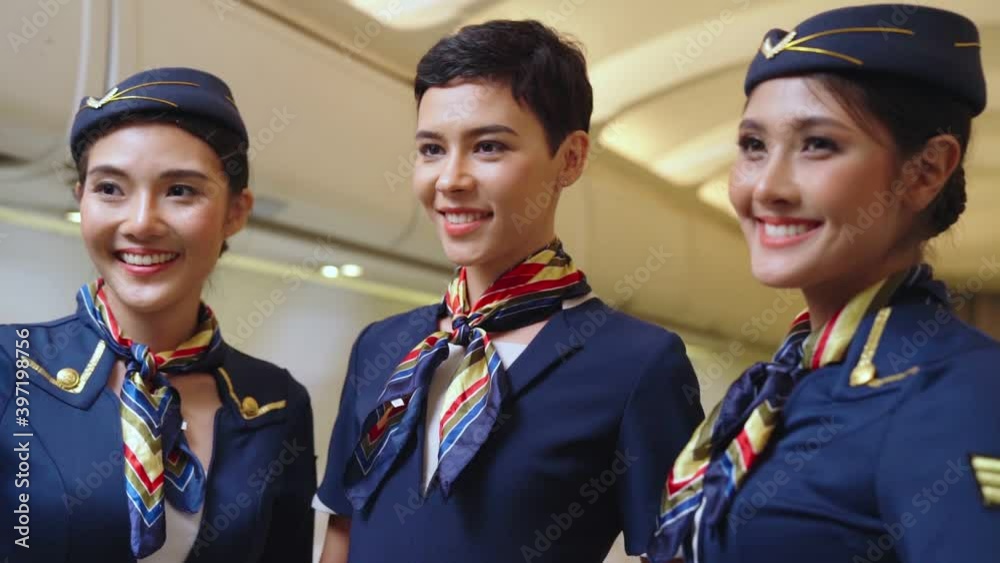 Group of cabin crew or air hostess in airplane . Airline transportation ...
