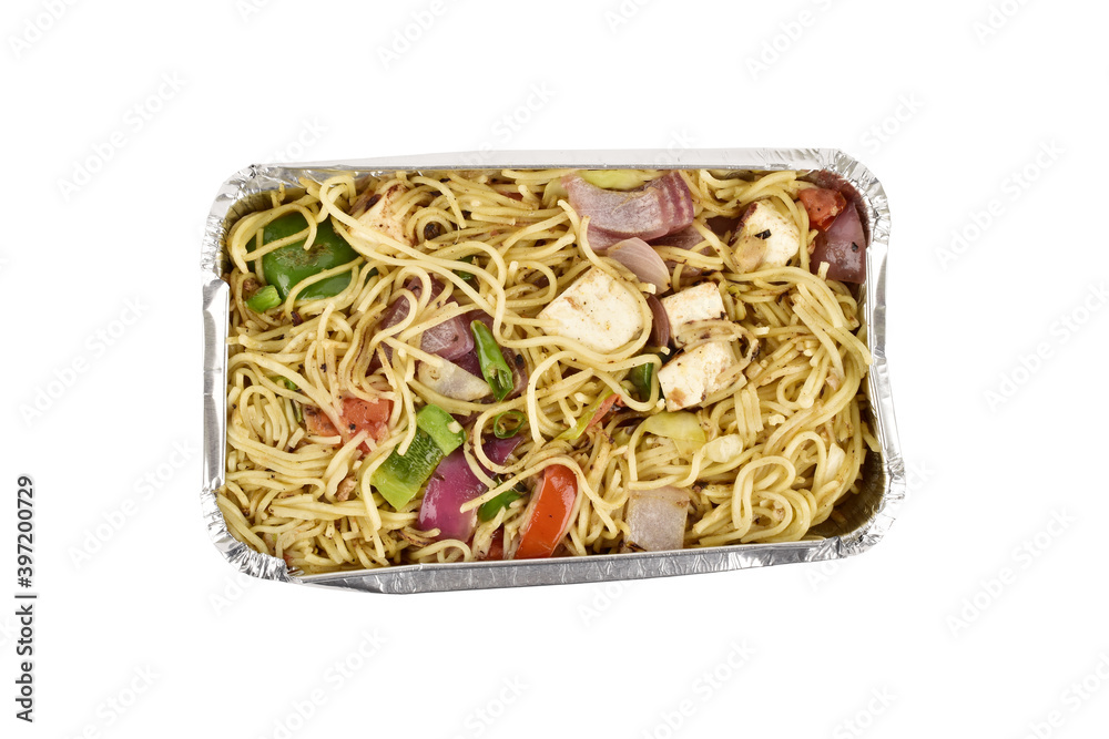 Top view of veg noodles take away meal in a foil tray isolated on a ...