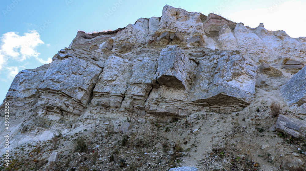 sandy-gypsum cut of the earth in quarry for the extraction of gypsum ...