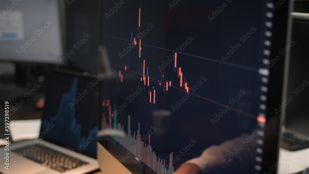 Computer screen with stock market changes, scrolling and analysing ...