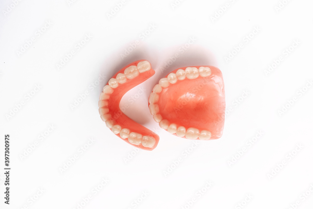 Top view of complete denture on white background. Full denture close-up ...