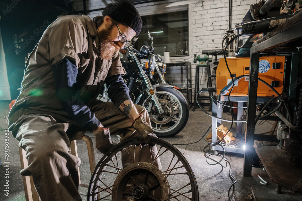 Men build a motorcycle Stock Photo | Adobe Stock