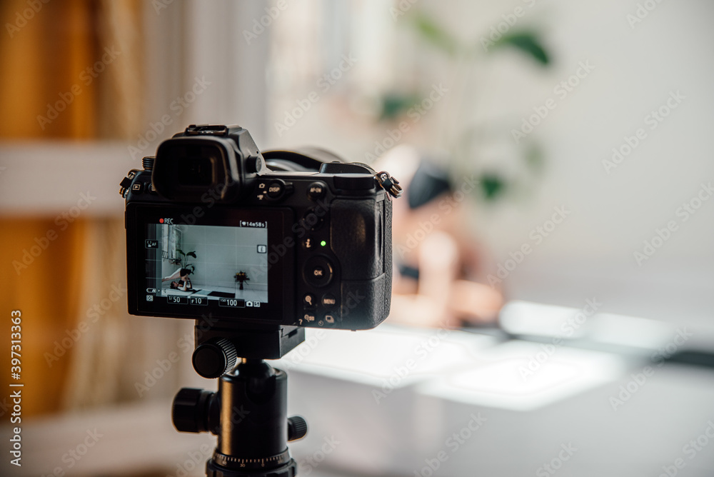 Professional camera recording video of woman practicing yoga Stock ...